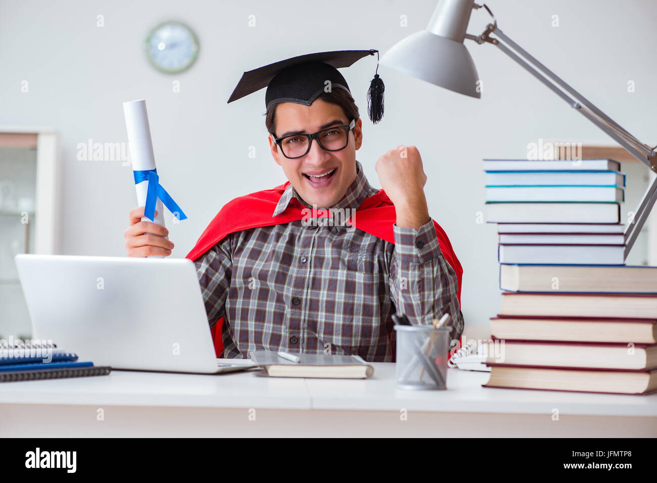Super hero student with books studying for exams Stock Photo - Alamy