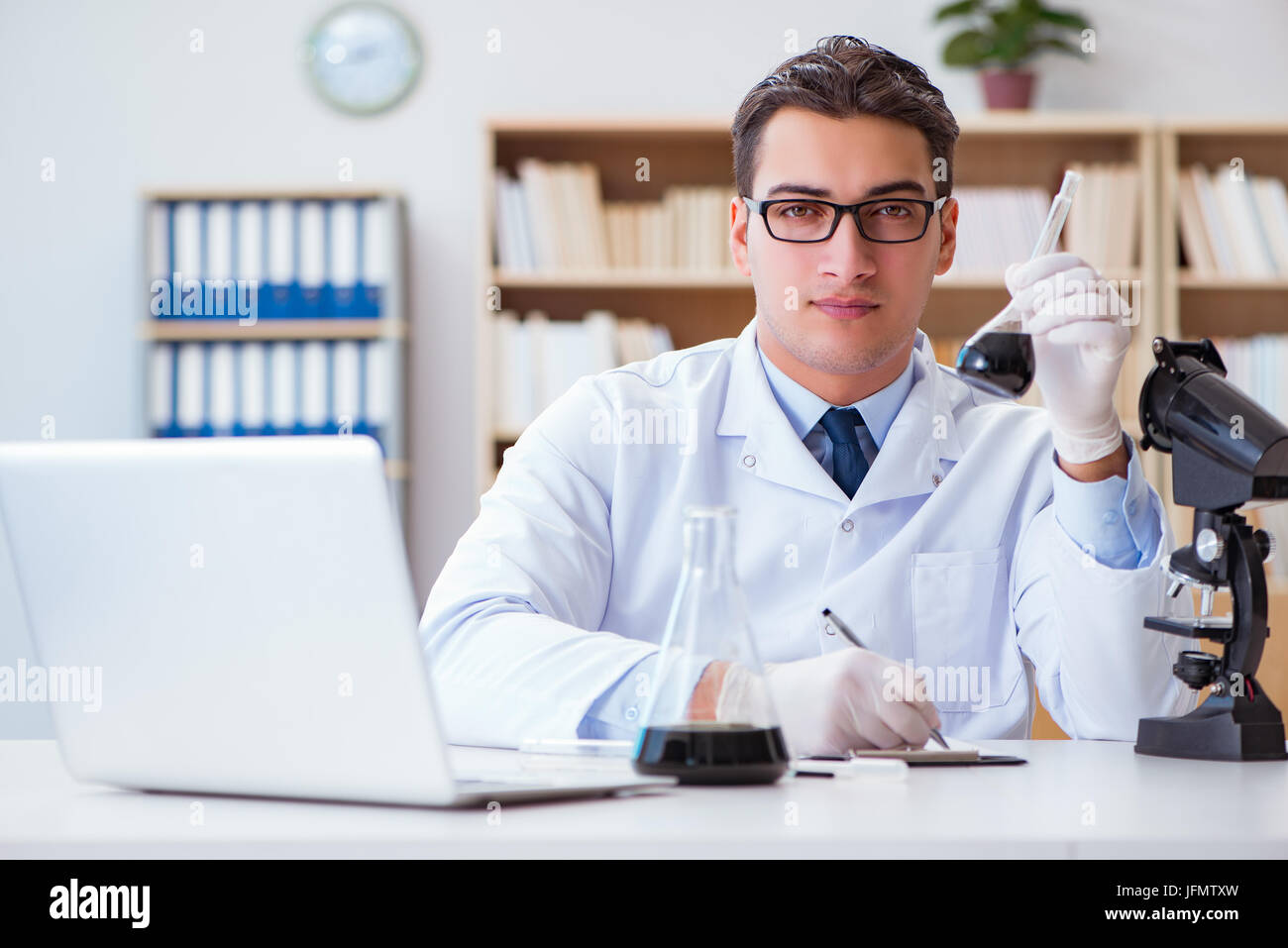 Chemical engineer working on oil samples in lab Stock Photo - Alamy