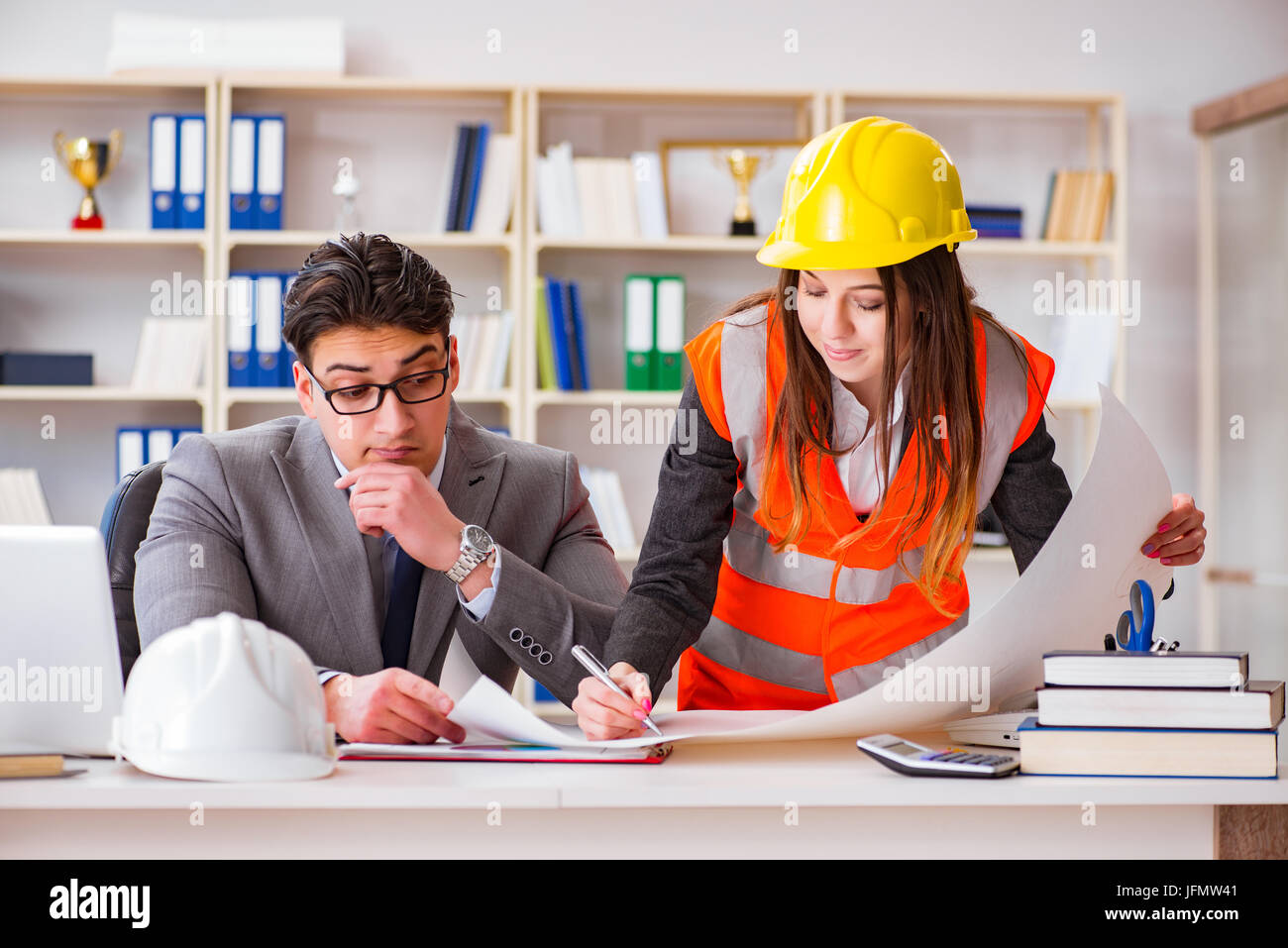 Construction foreman supervisor reviewing drawings Stock Photo - Alamy