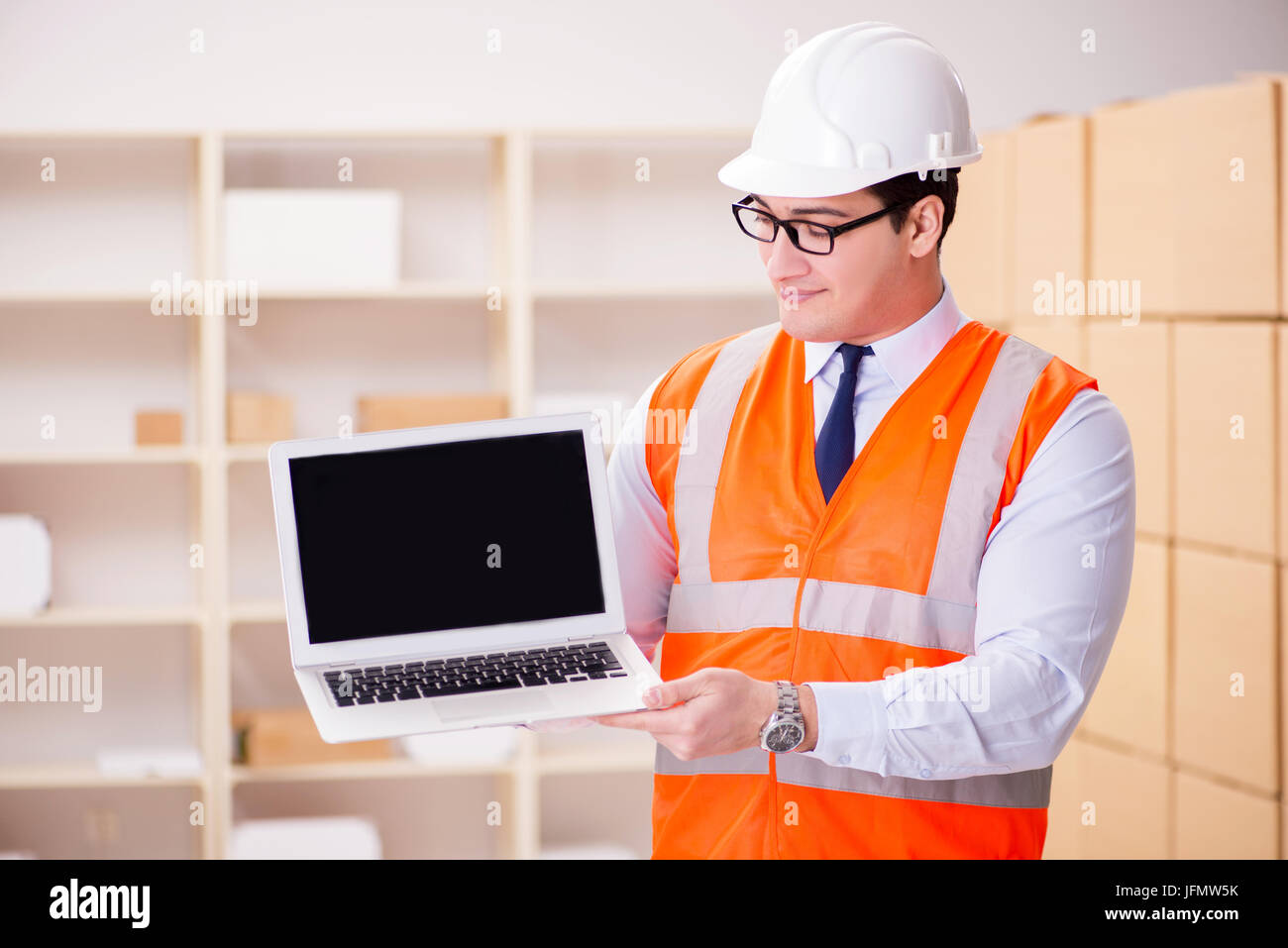Man working in postal parcel delivery service office Stock Photo - Alamy