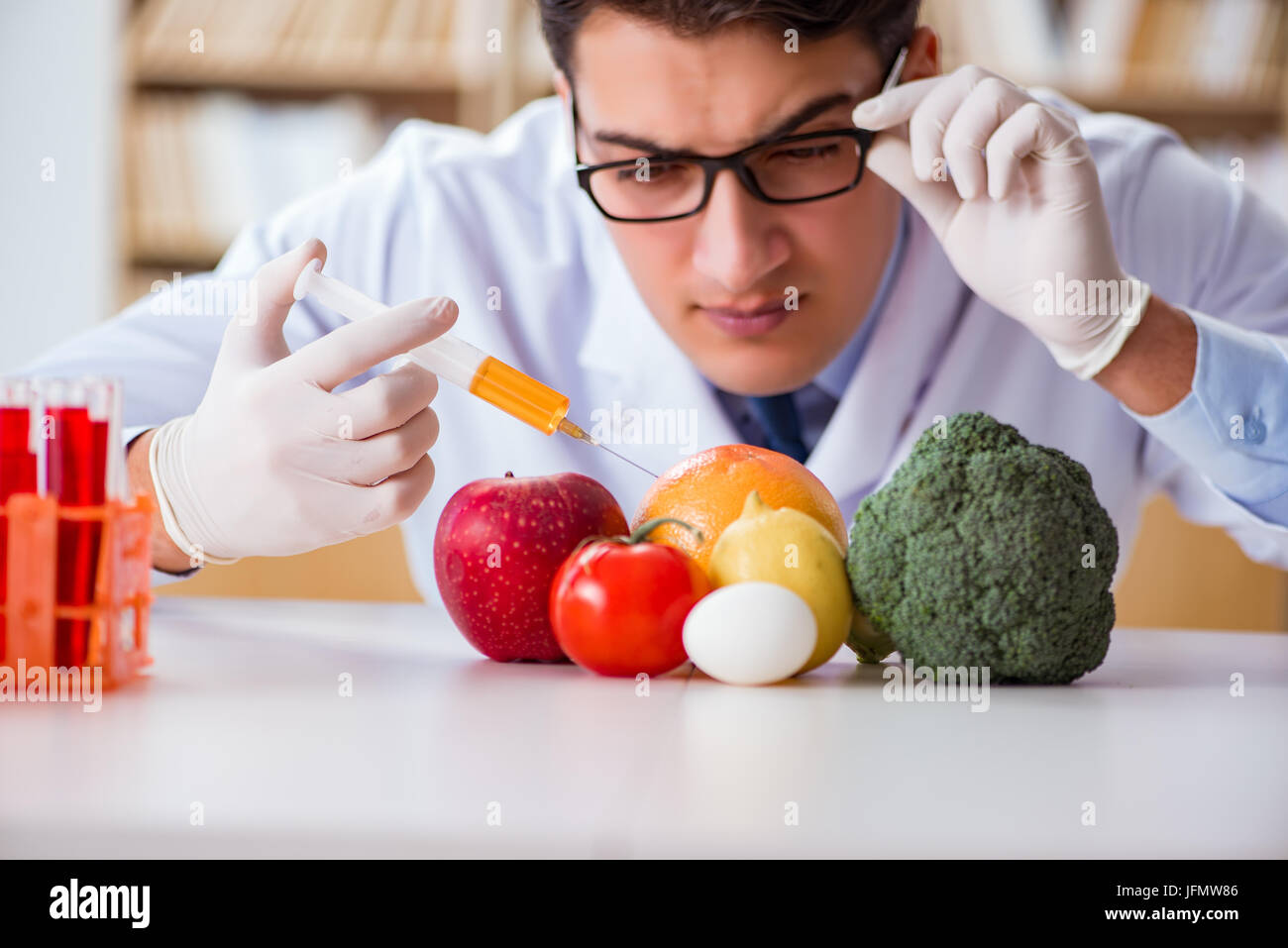 Man doctor checking the fruits and vegetables Stock Photo - Alamy