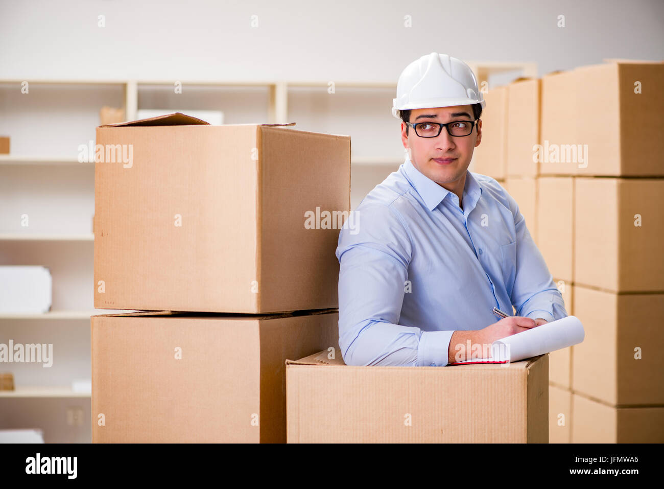 Man working in box delivery relocation service Stock Photo - Alamy