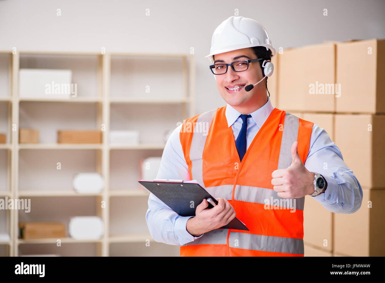 Man working in postal parcel delivery service office Stock Photo - Alamy