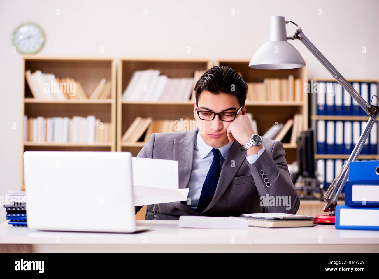 Businessman receiving letter envelope in office Stock Photo - Alamy