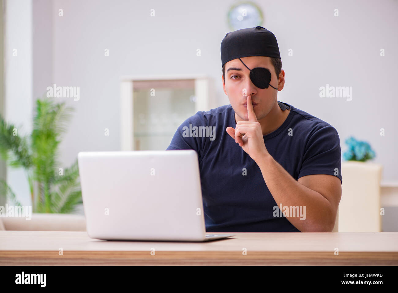 Digital security concept with pirate at computer Stock Photo - Alamy