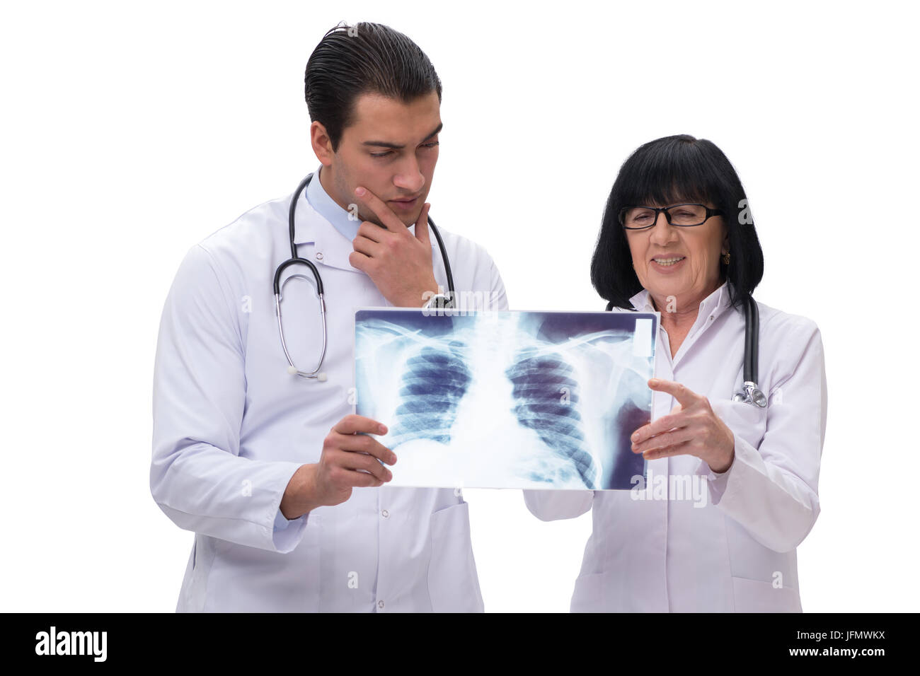 Two doctors looking at x-ray image isolated on white Stock Photo - Alamy
