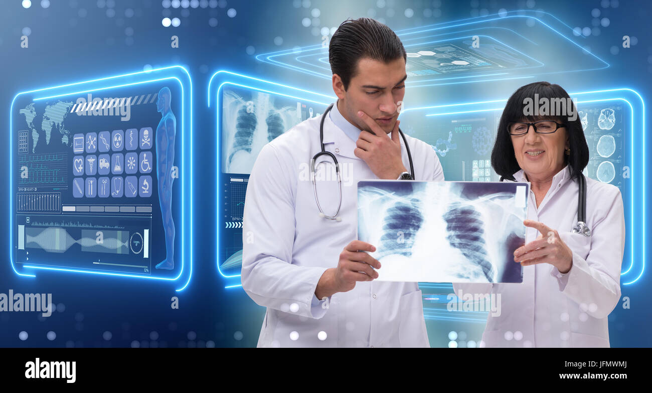 Two doctors looking at x-ray image Stock Photo - Alamy