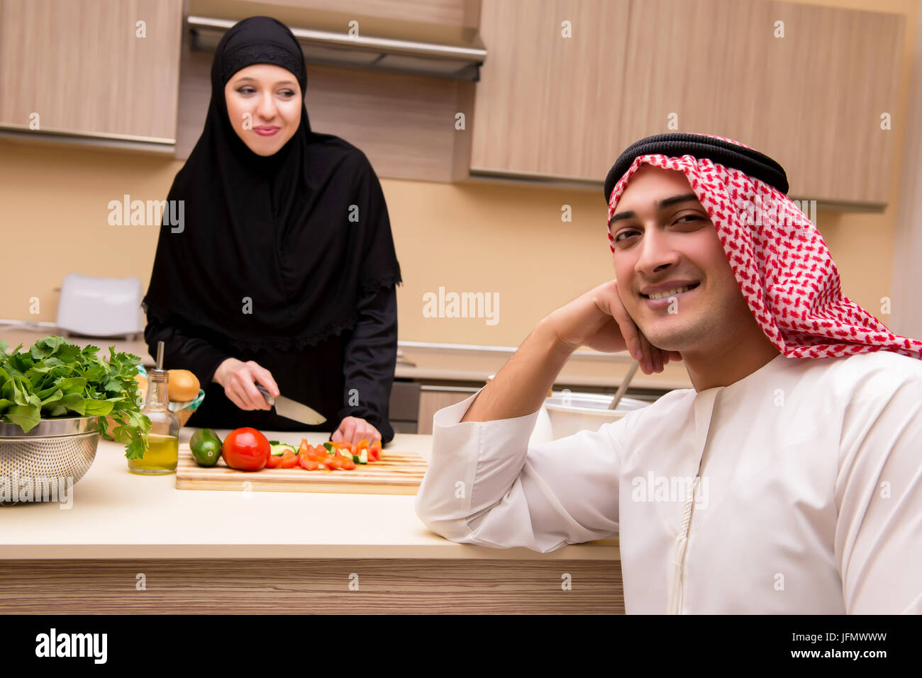 Arab woman cooking in kitchen hi-res stock photography and images - Alamy