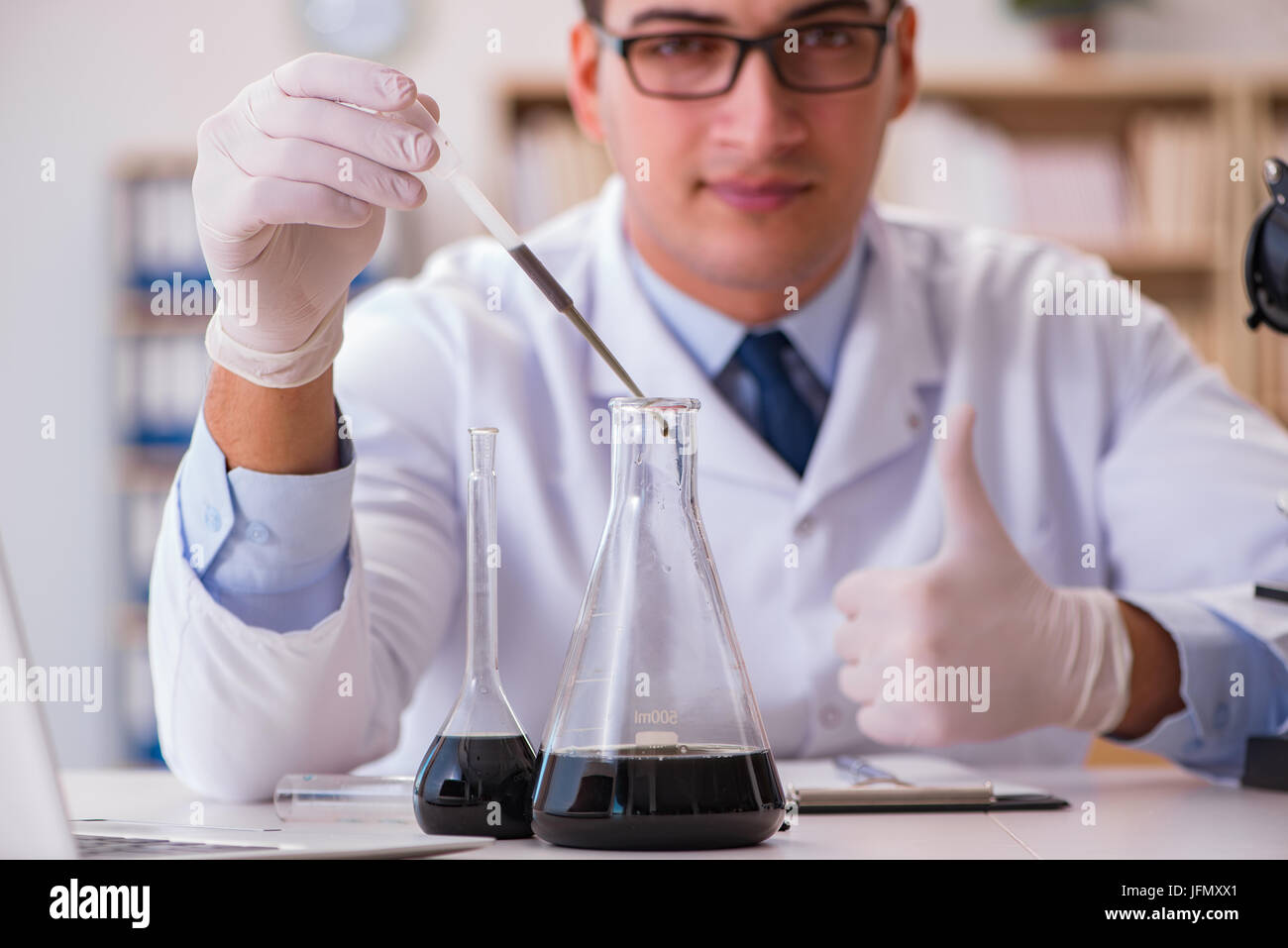 Young lab assistan working in the laboratory Stock Photo - Alamy