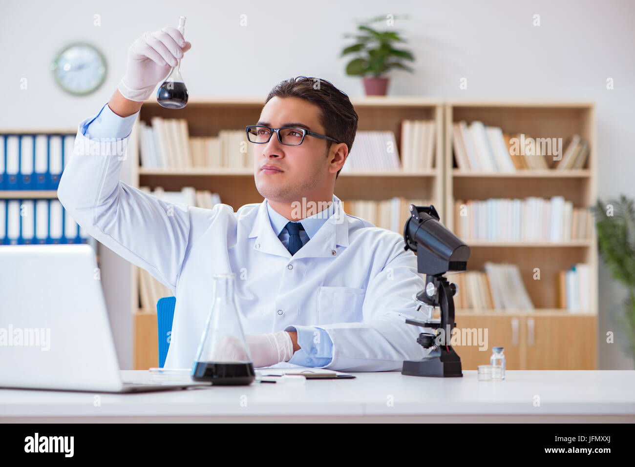 Chemical engineer working on oil samples in lab Stock Photo - Alamy