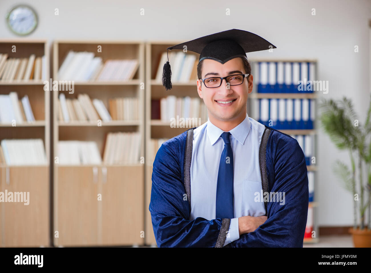 Young man graduating from university Stock Photo - Alamy