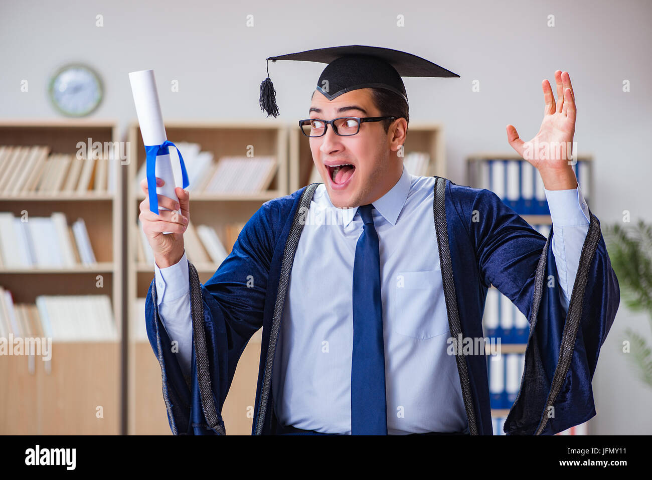 Young man graduating from university Stock Photo - Alamy