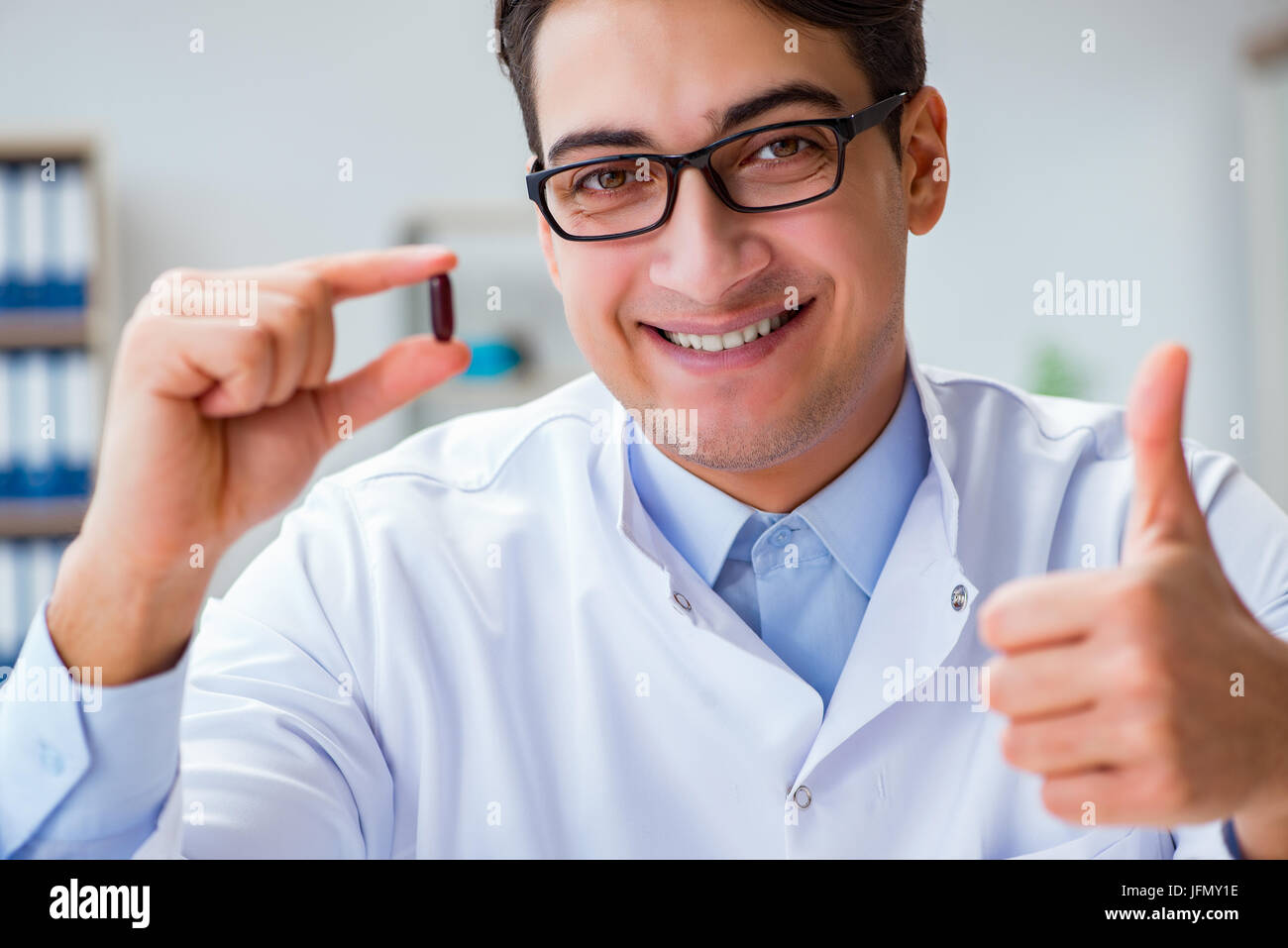 Doctor holding medicines in the lab Stock Photo - Alamy