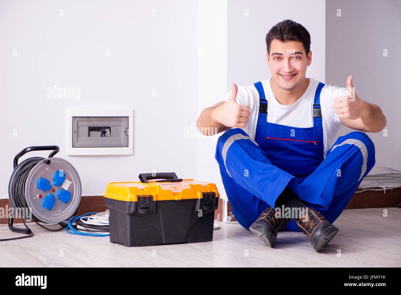 Professional electrician doing socket installation hi-res stock ...