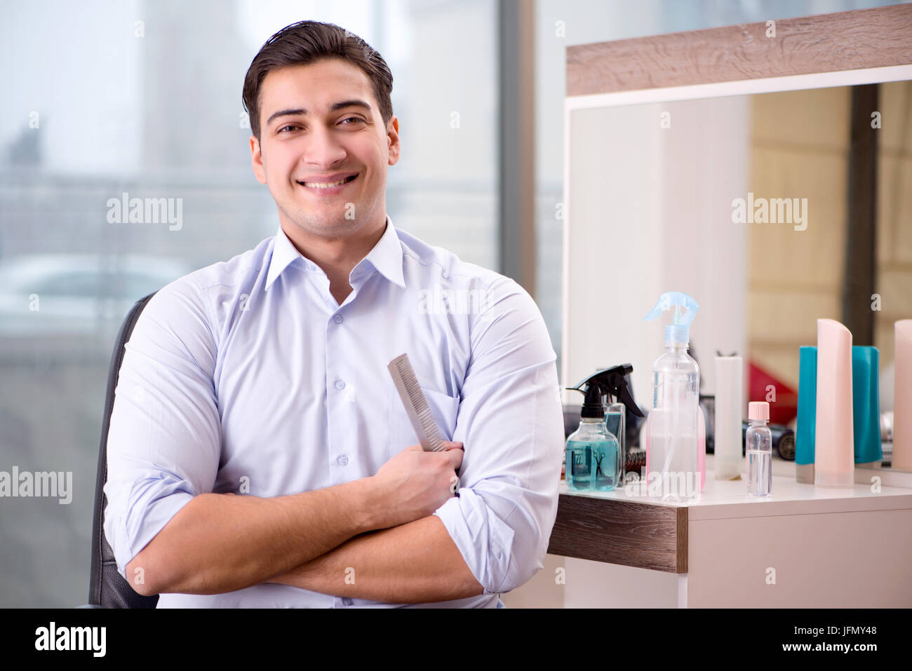 Handsome man in beauty salon Stock Photo - Alamy