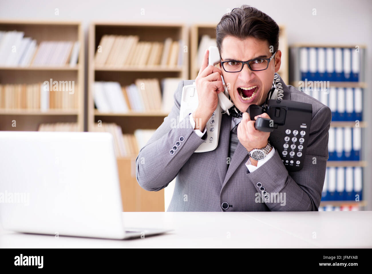 The angry helpdesk operator yelling in office Stock Photo - Alamy