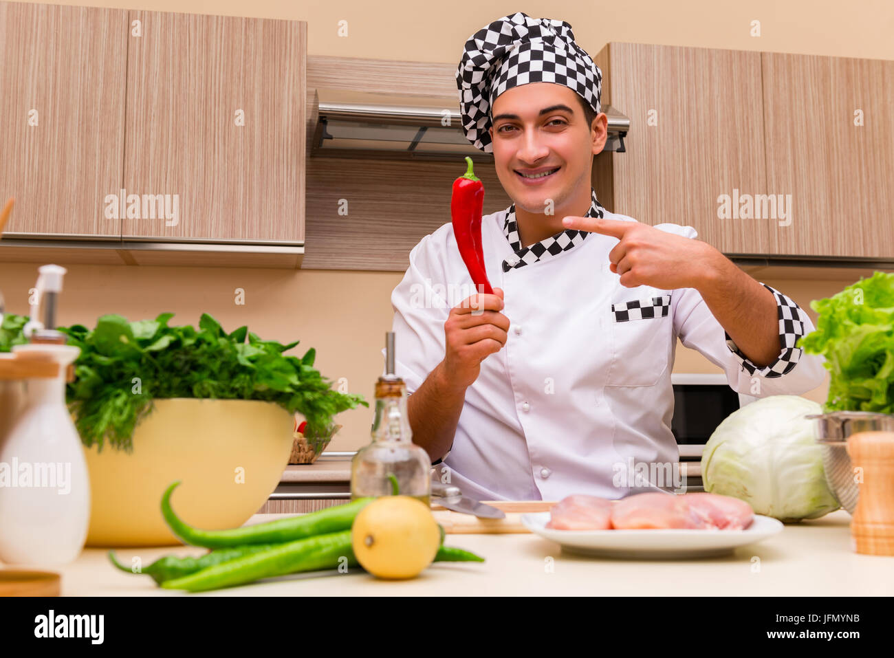 The young chef working in the kitchen Stock Photo - Alamy