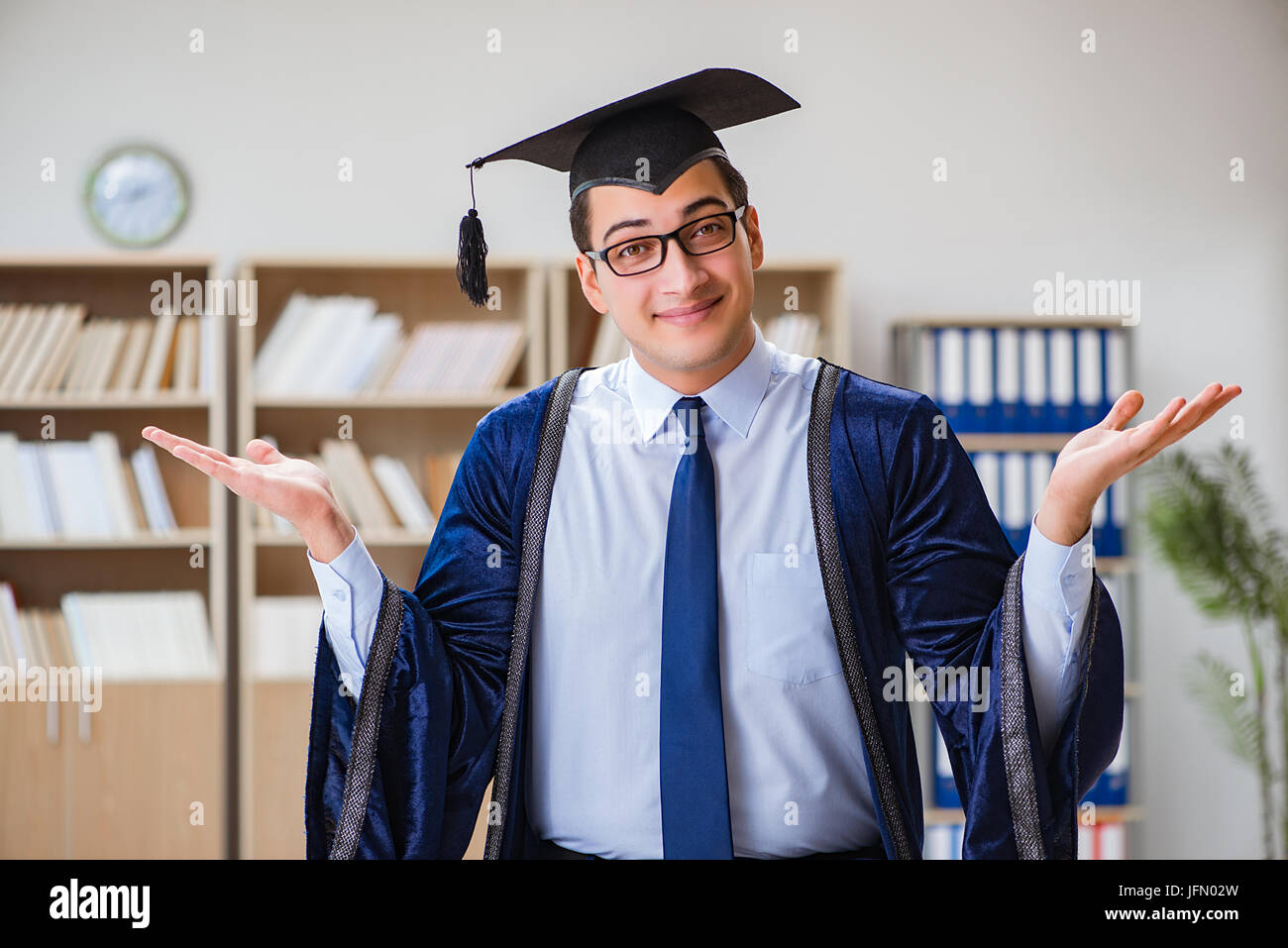 The young man graduating from university Stock Photo - Alamy