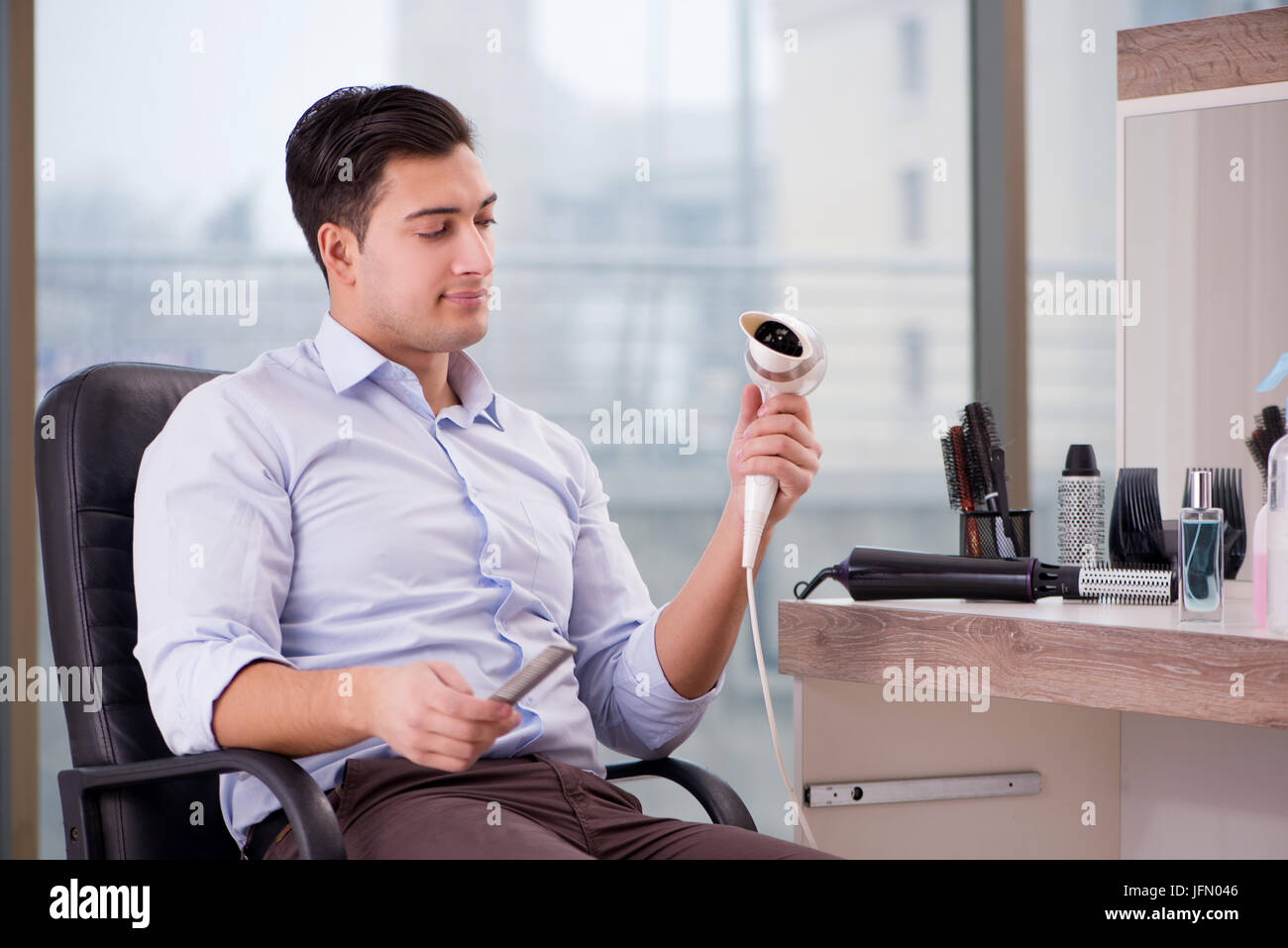 The handsome man in hair salon doing haircut Stock Photo - Alamy