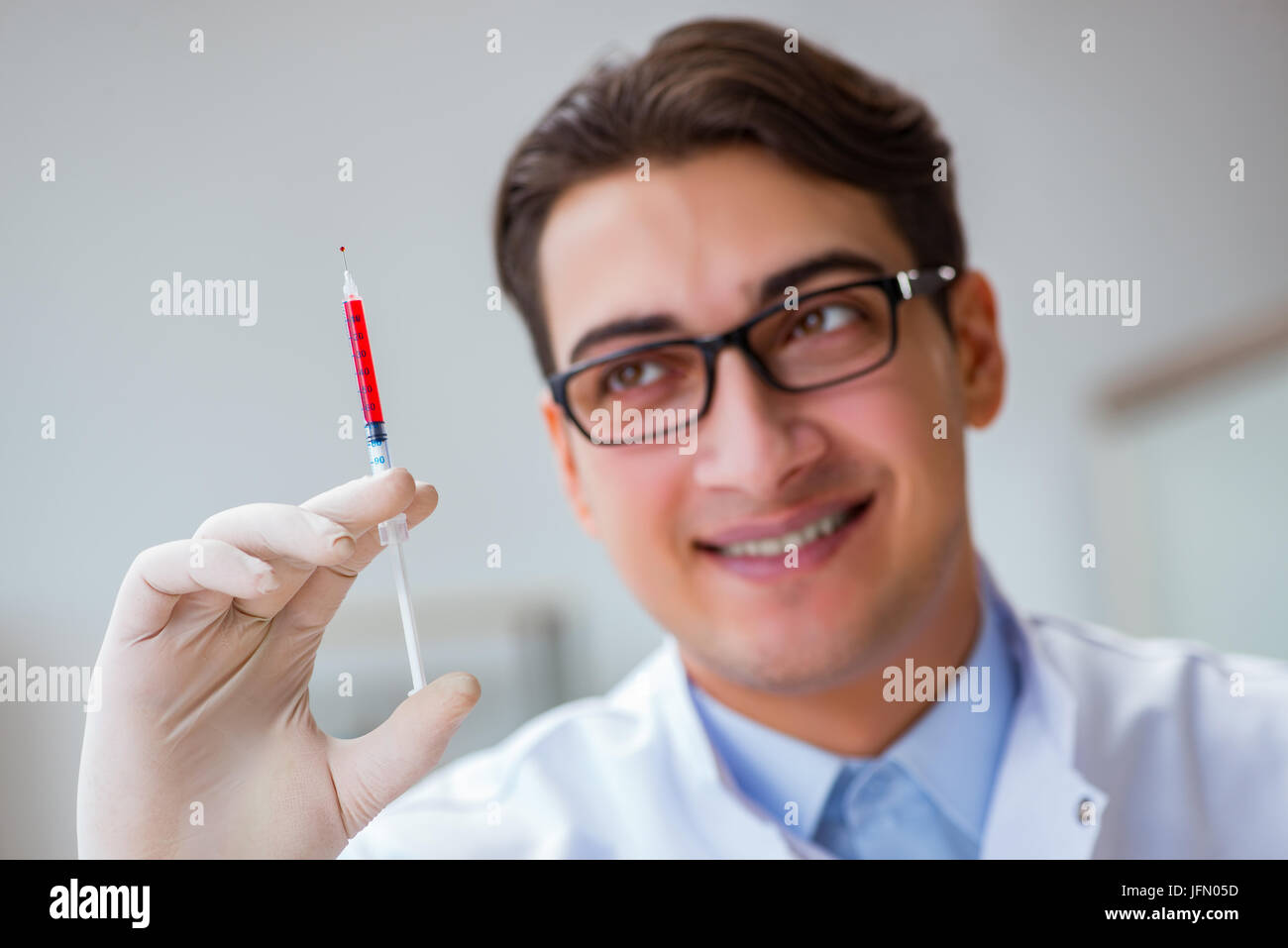The doctor working with blood samples Stock Photo - Alamy