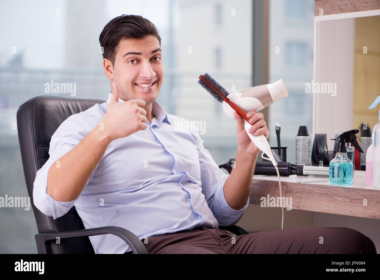 The handsome man in hair salon doing haircut Stock Photo - Alamy