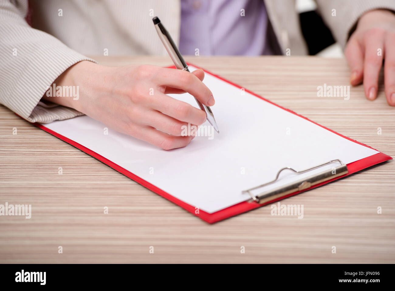 The hands taking notes in the pad Stock Photo - Alamy