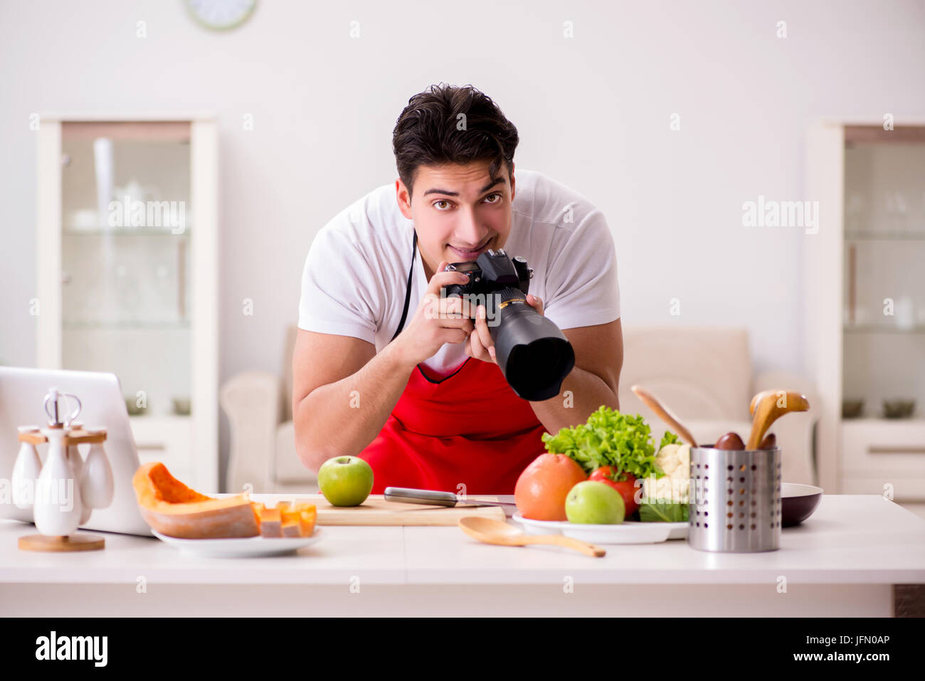 The food photographer taking photos in kitchen Stock Photo - Alamy