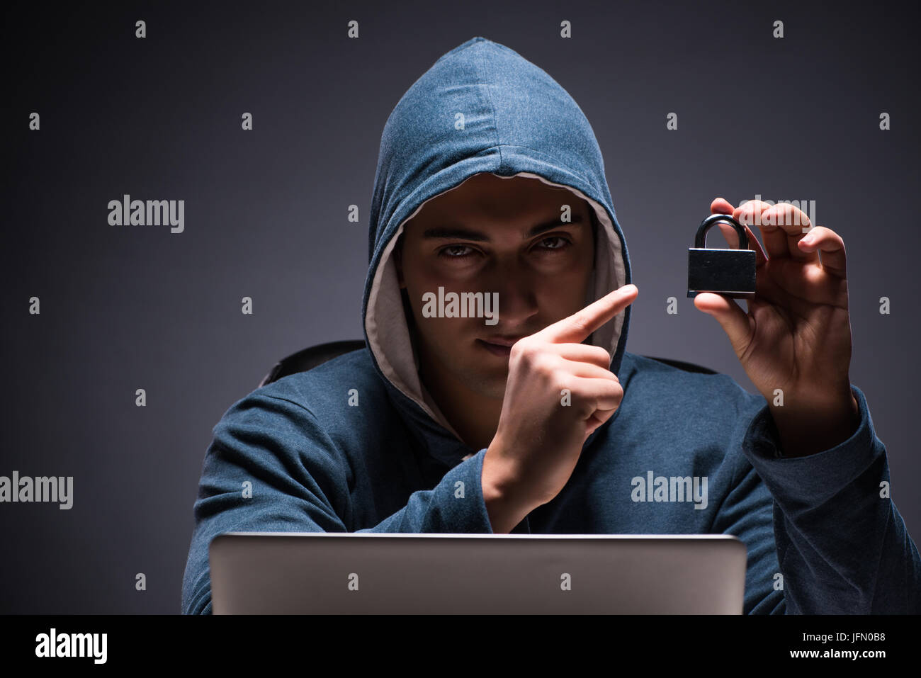The computer hacker working in dark room Stock Photo - Alamy