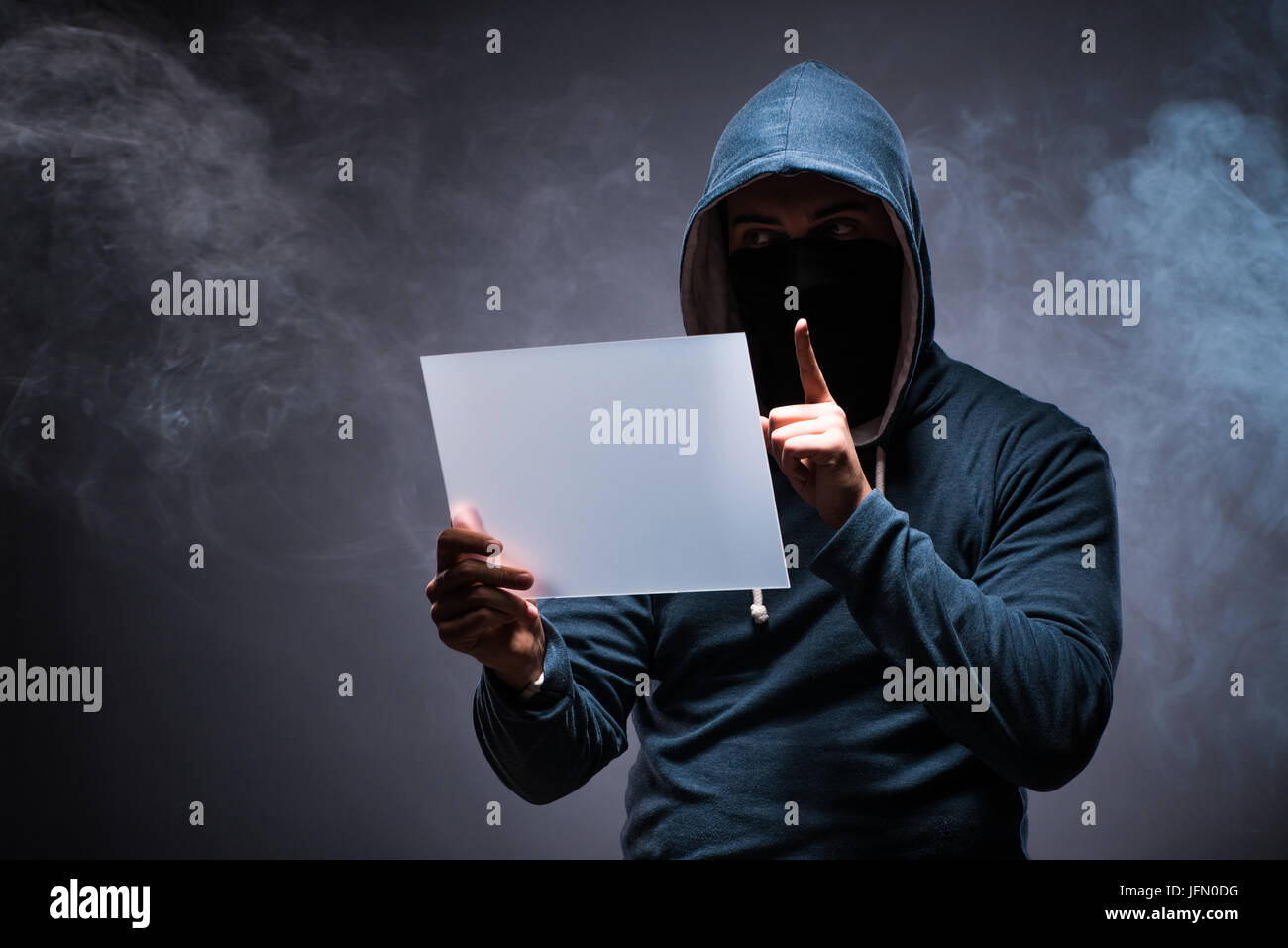 The hacker working on tablet in dark Stock Photo - Alamy