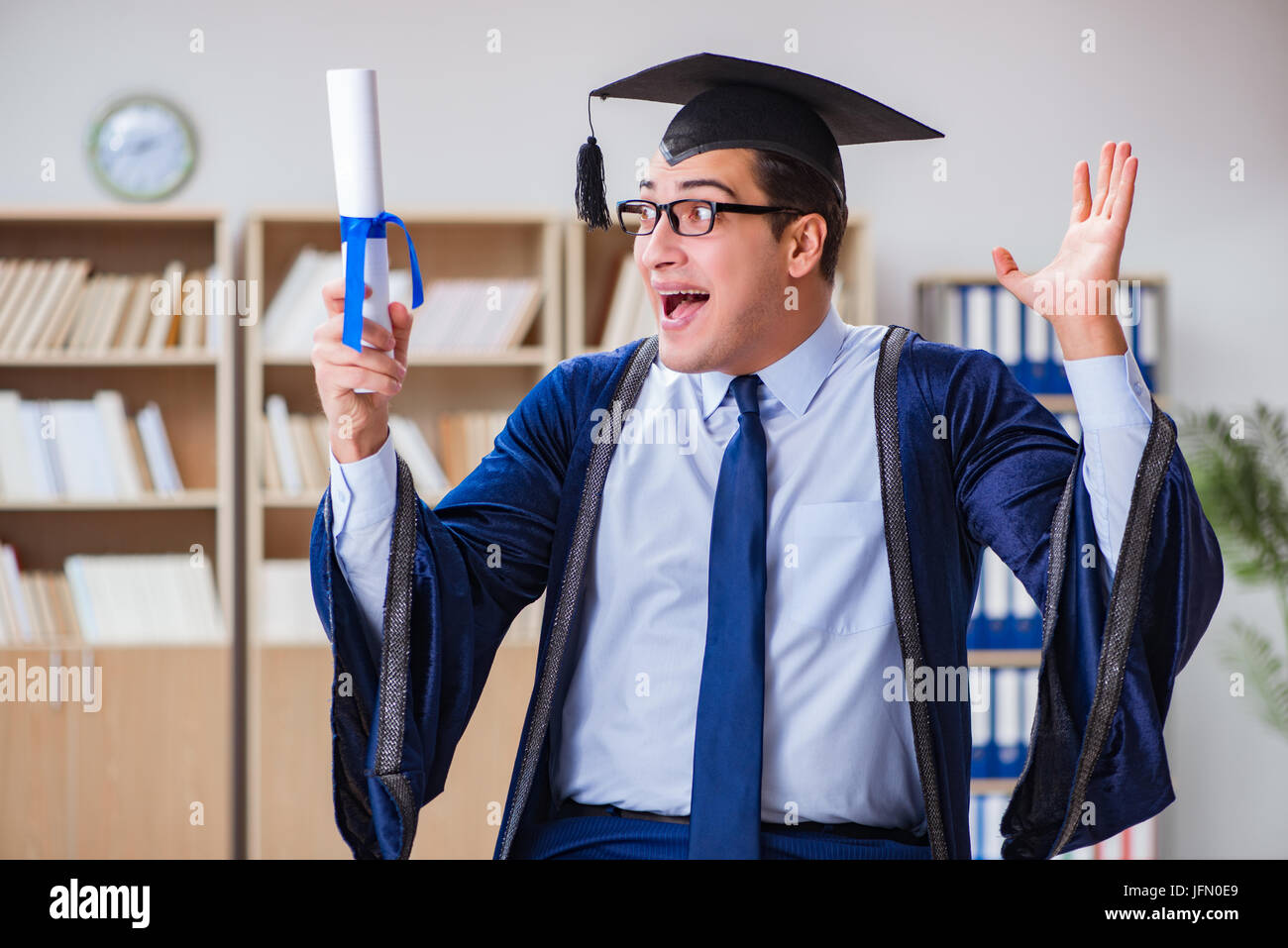 The young man graduating from university Stock Photo - Alamy