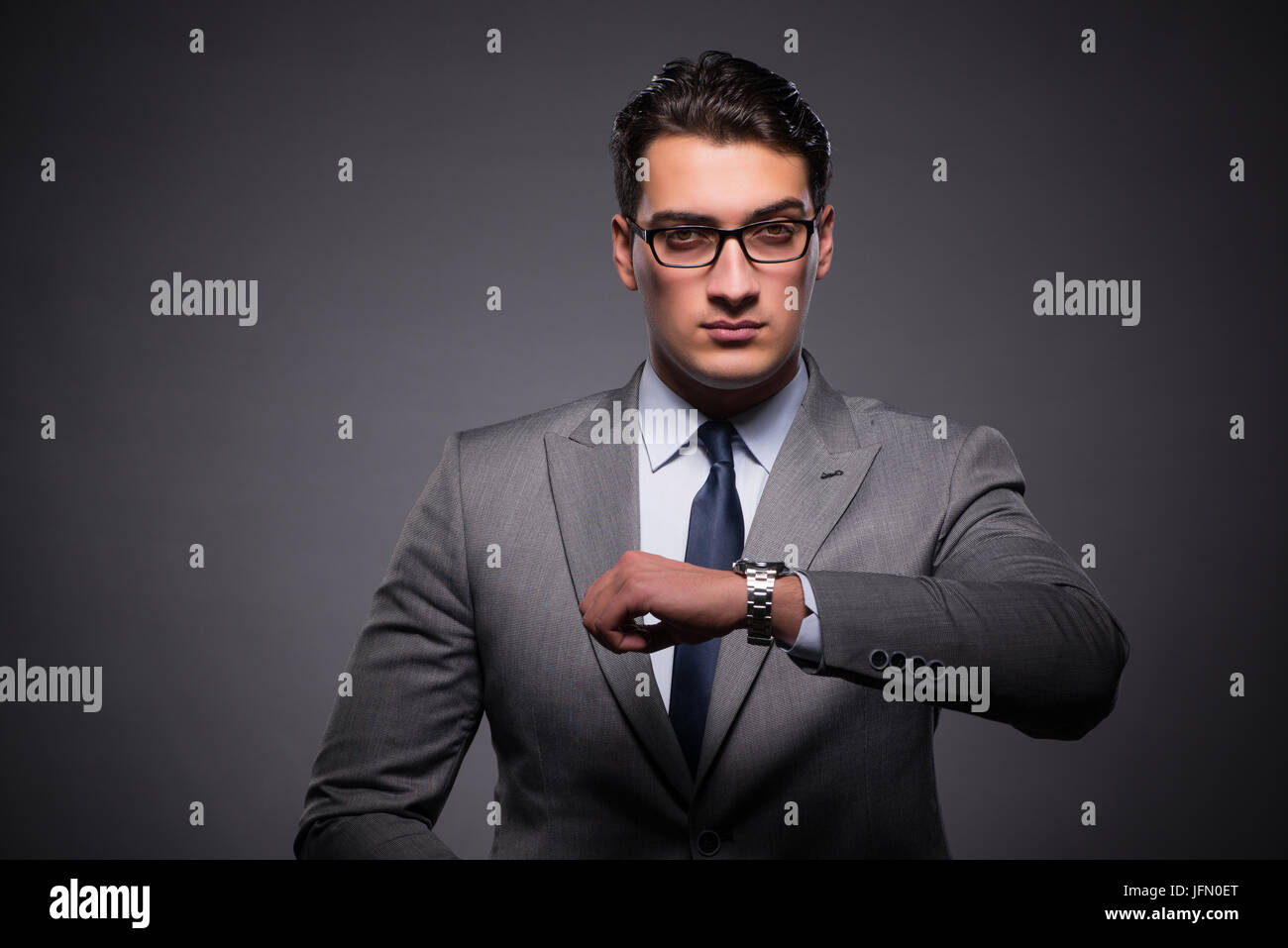 The businessman in time management concept Stock Photo - Alamy