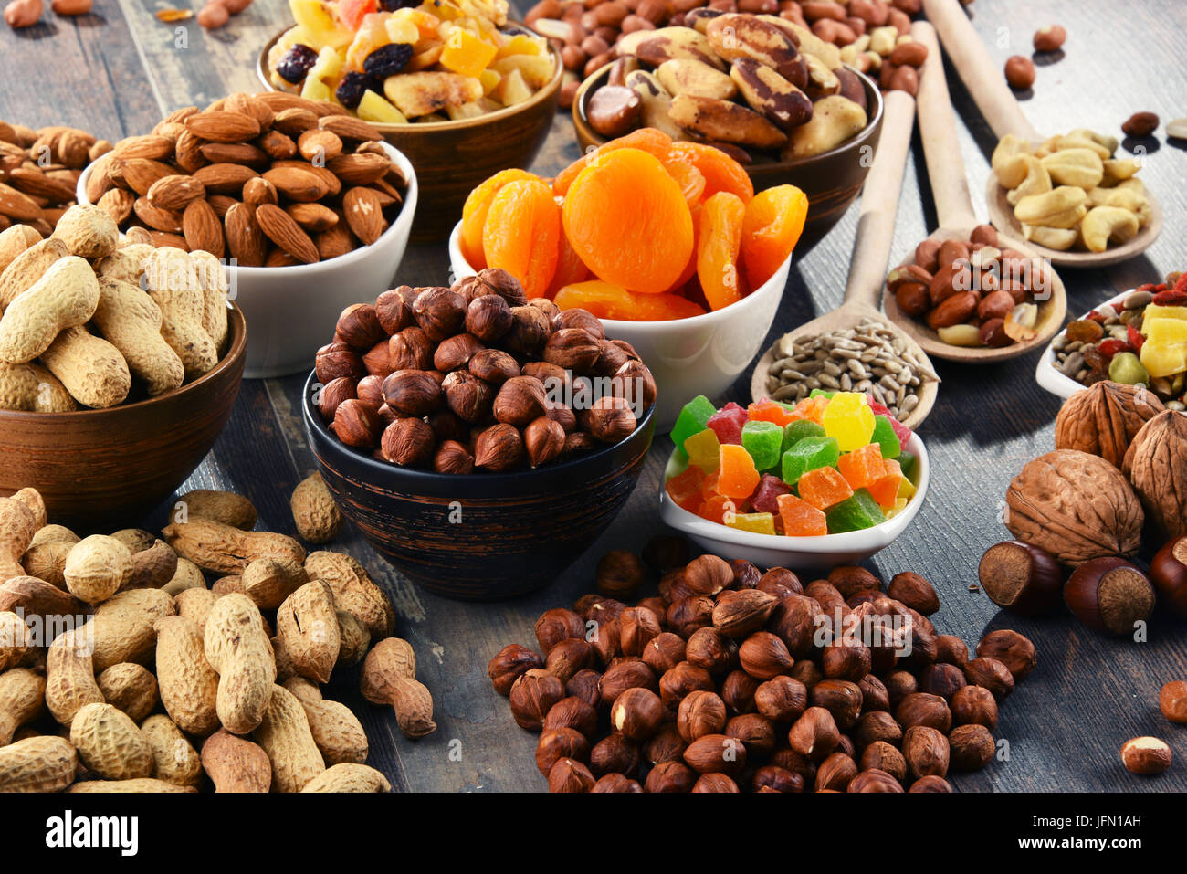 Composition with dried fruits and assorted nuts. Delicacies Stock Photo ...
