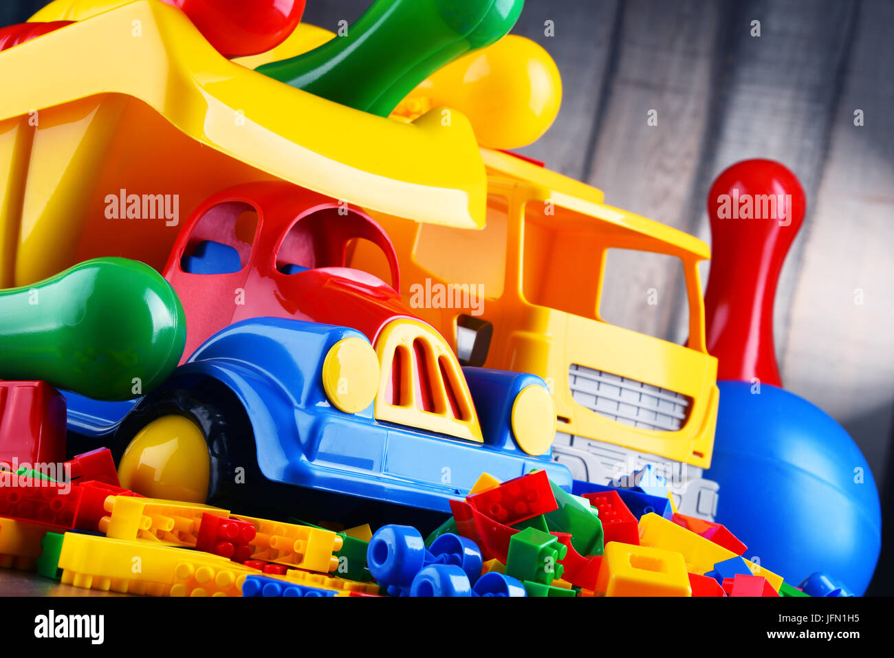 Colorful plastic toys in children's room Stock Photo - Alamy