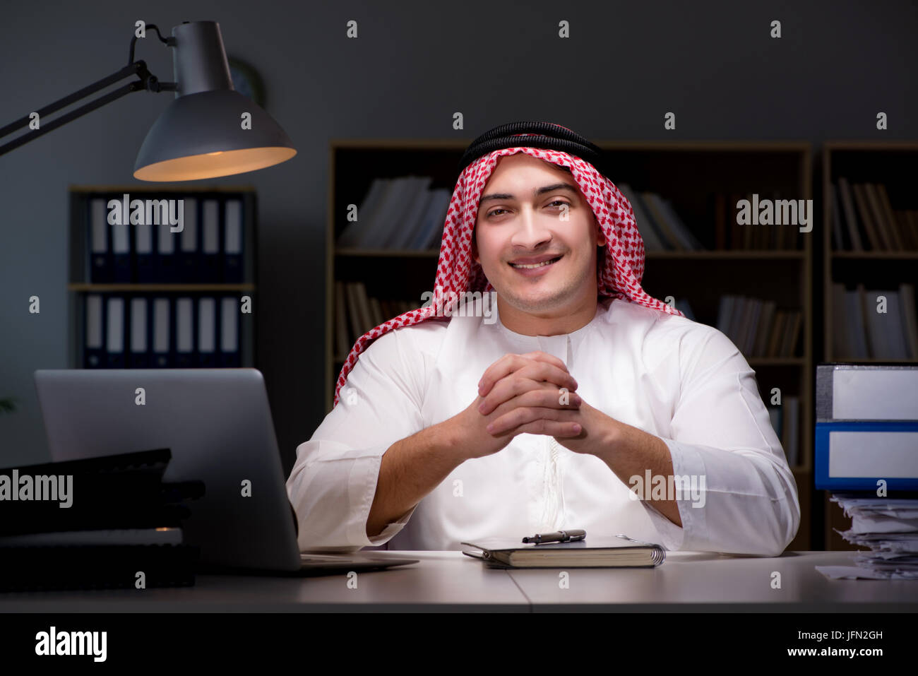 The arab businessman working late in office Stock Photo - Alamy