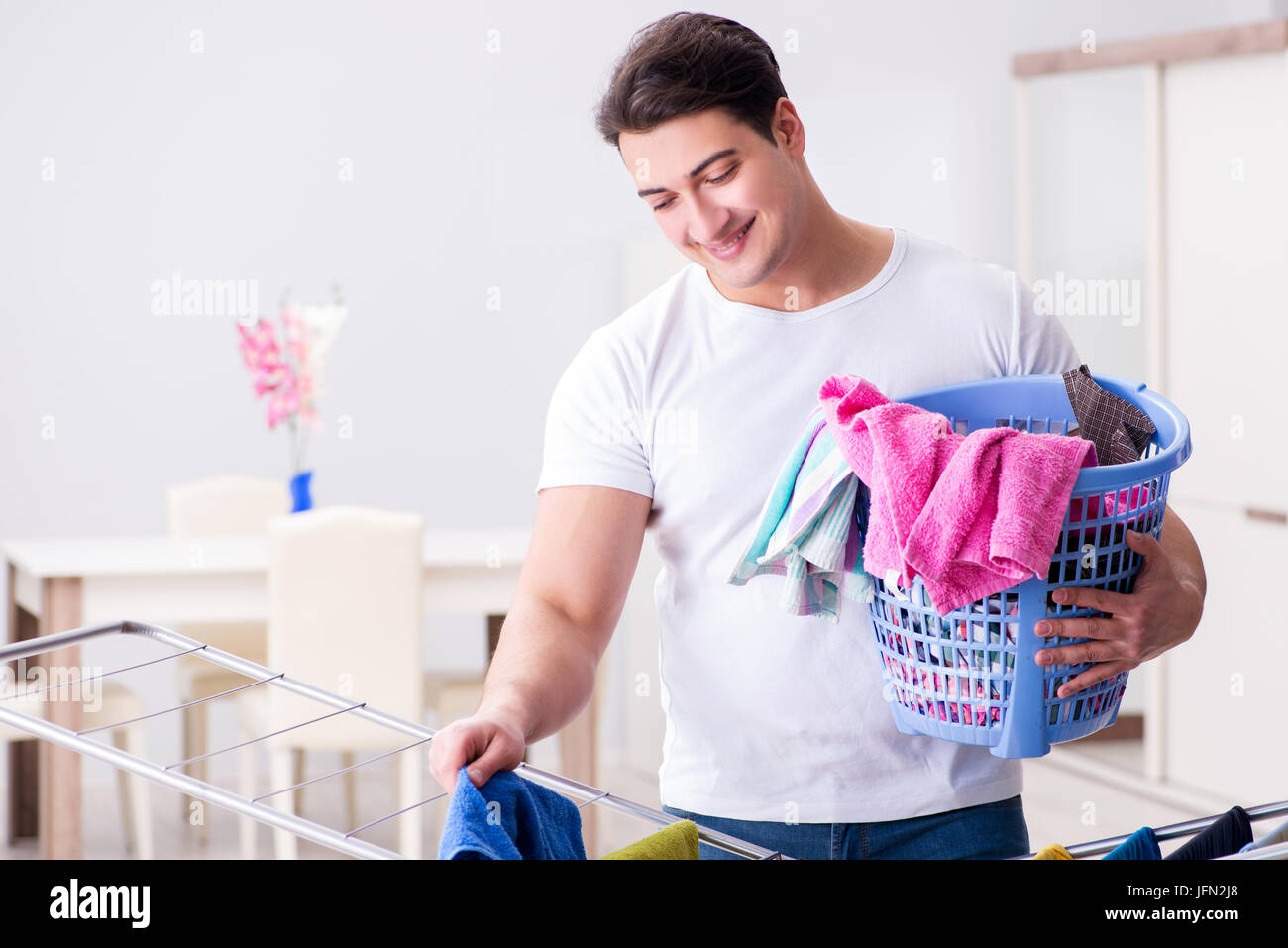 The man doing laundry at home Stock Photo - Alamy