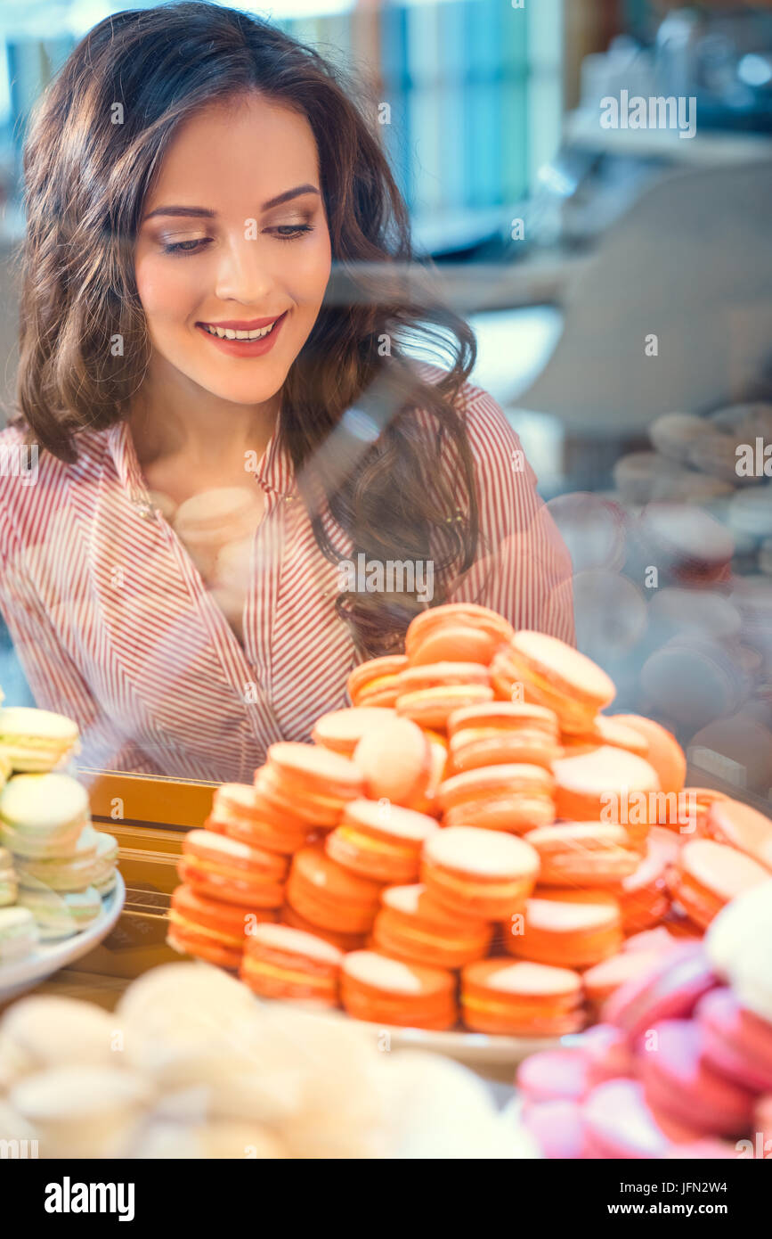 Woman at showcase Stock Photo - Alamy