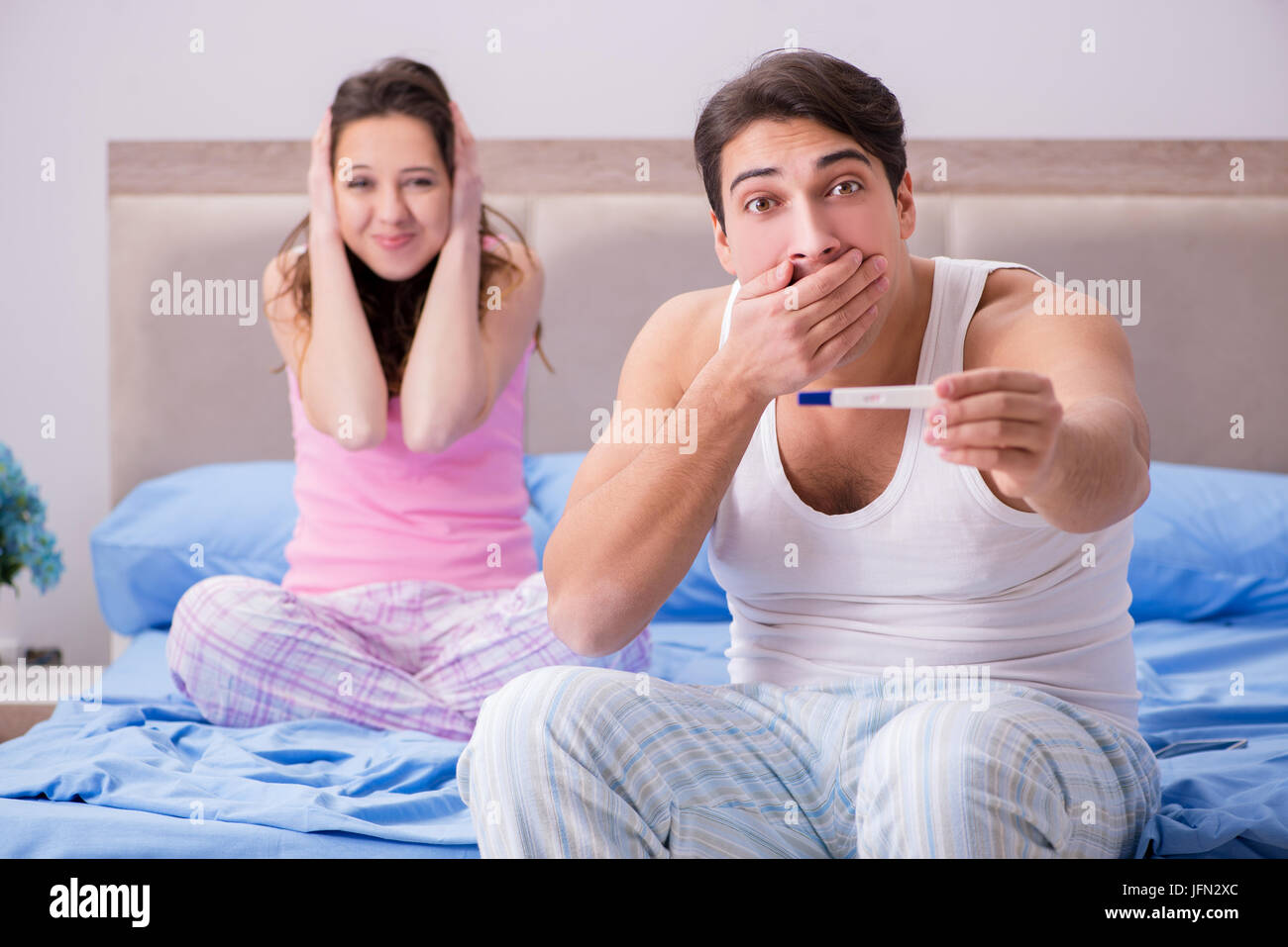 The happy couple finding out about pregnancy test results Stock Photo ...