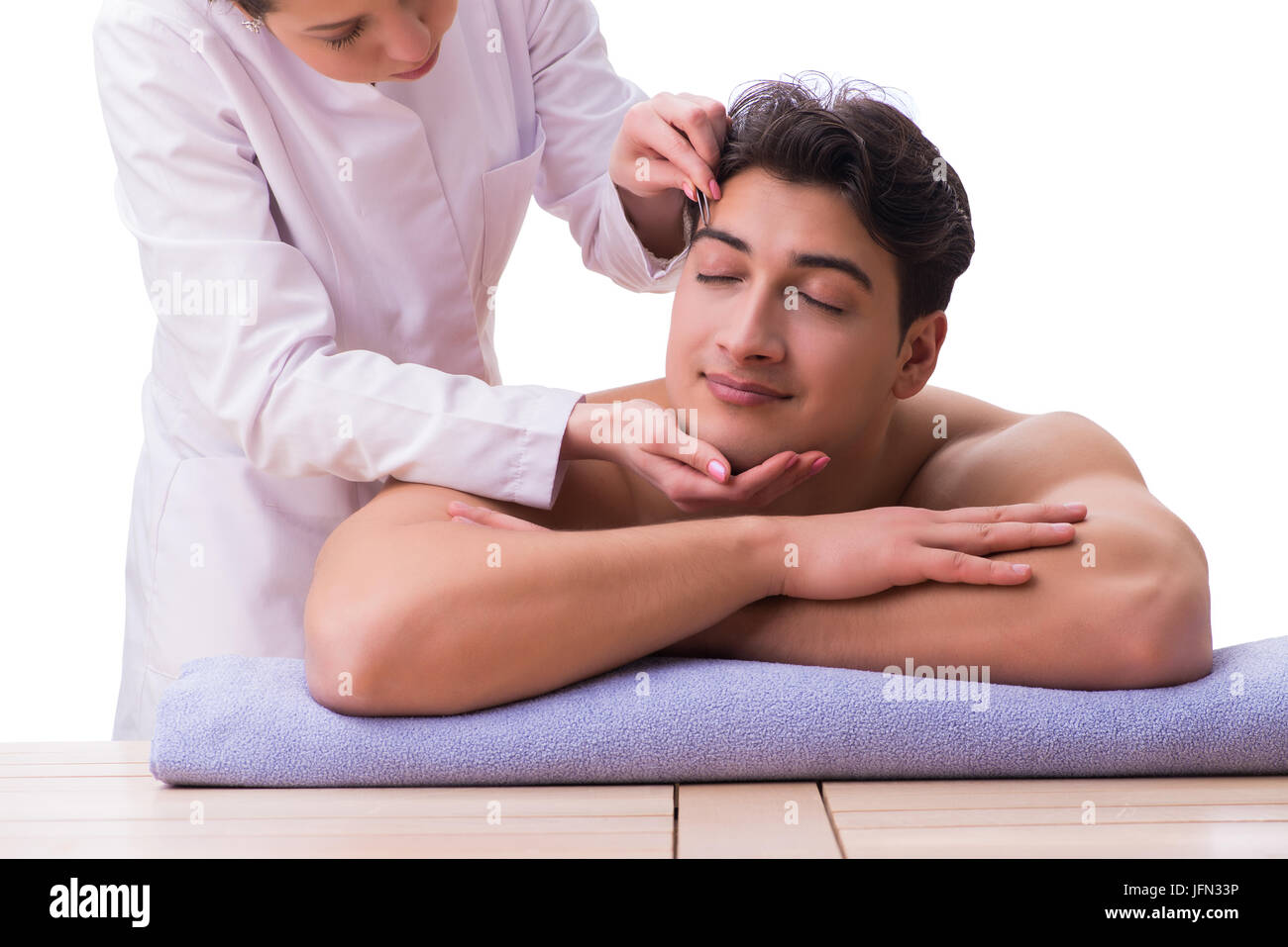 The handsome man in spa massage concept Stock Photo - Alamy