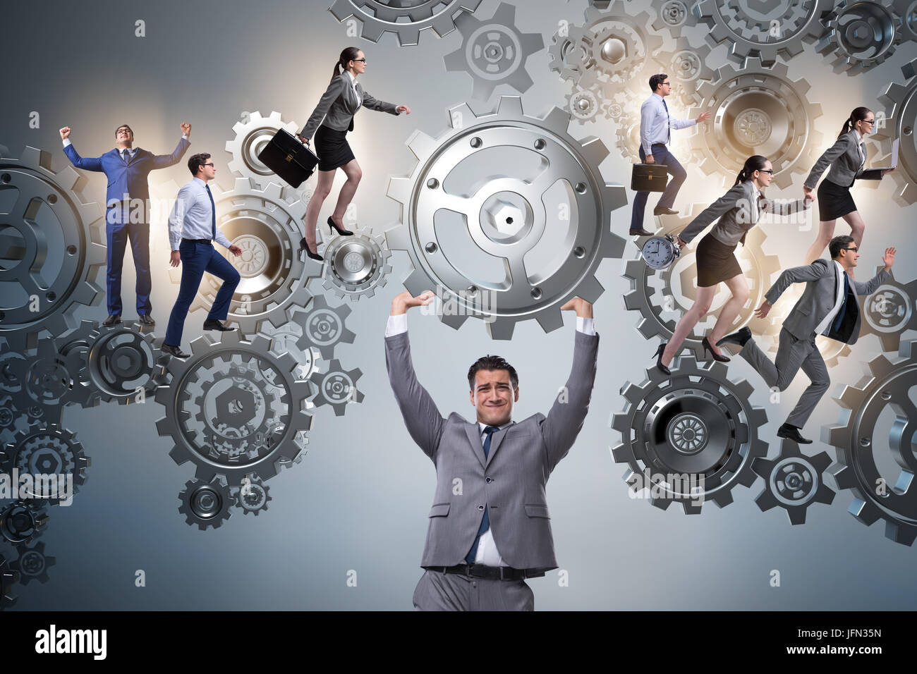 The businessman supporting gear in teamwork concept Stock Photo - Alamy