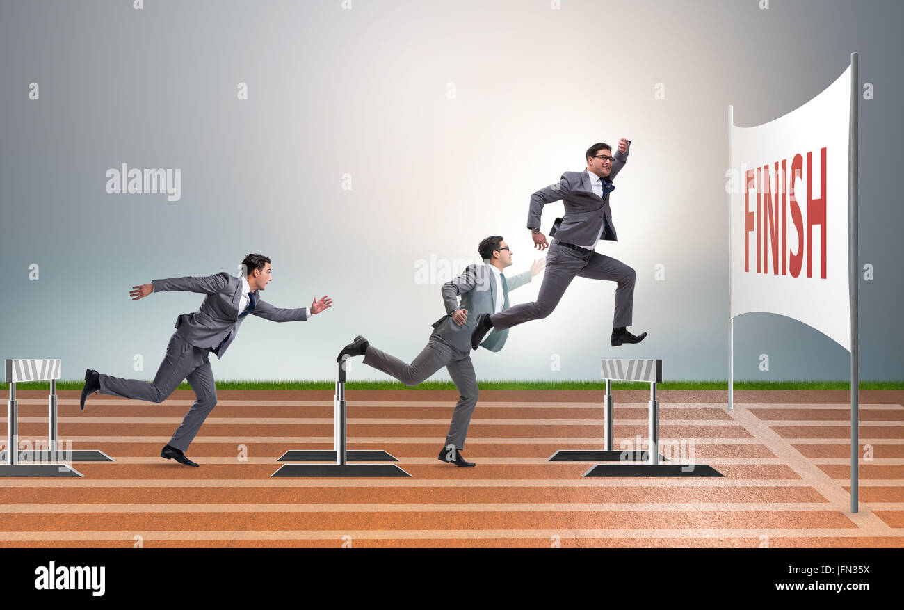 The businessman jumping over barriers in business concept Stock Photo ...