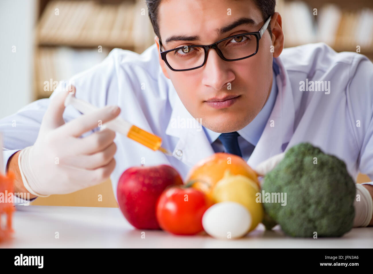 The man doctor checking the fruits and vegetables Stock Photo - Alamy