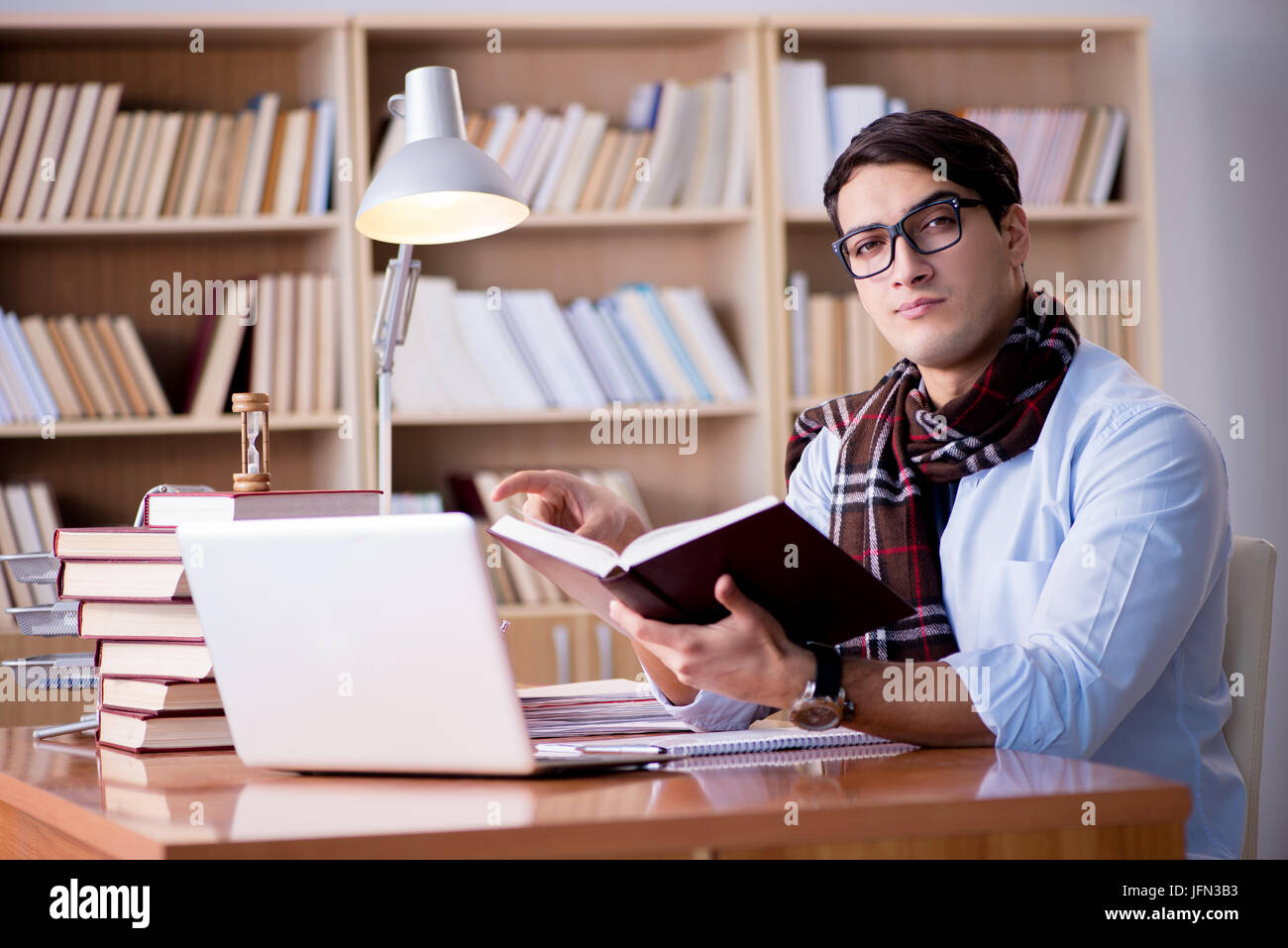 The young writer working in the library Stock Photo - Alamy