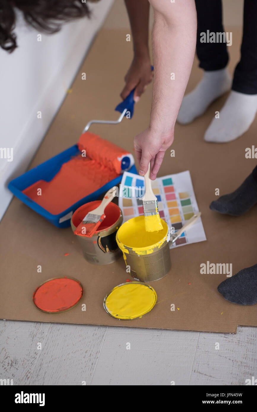 two painters prepare color for painting the wall Stock Photo - Alamy