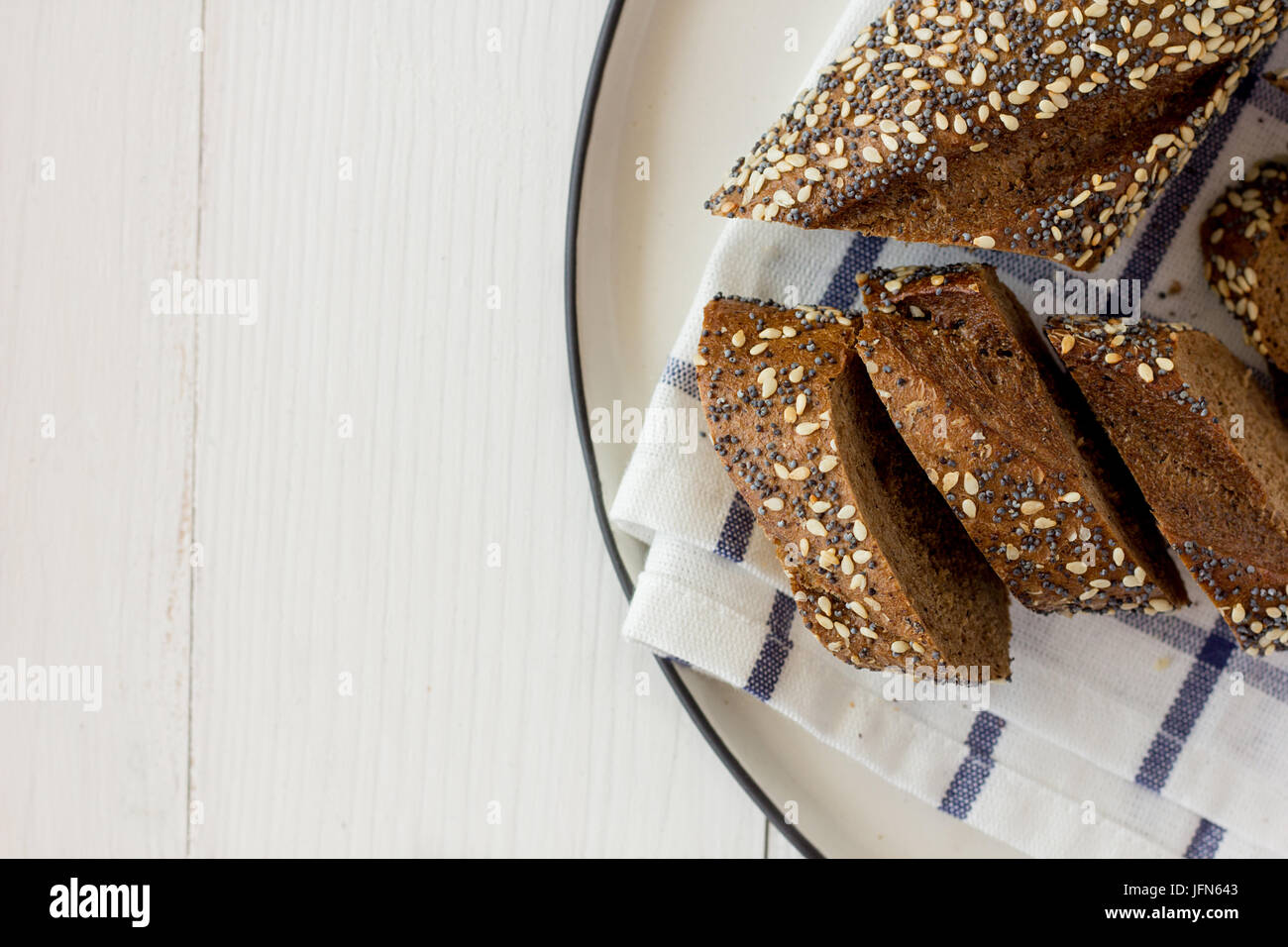 Cut rye bread with sesame top view selective focus Stock Photo - Alamy