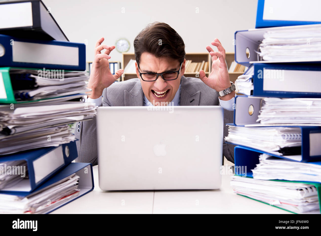 Busy businessman under stress due to excessive work Stock Photo - Alamy
