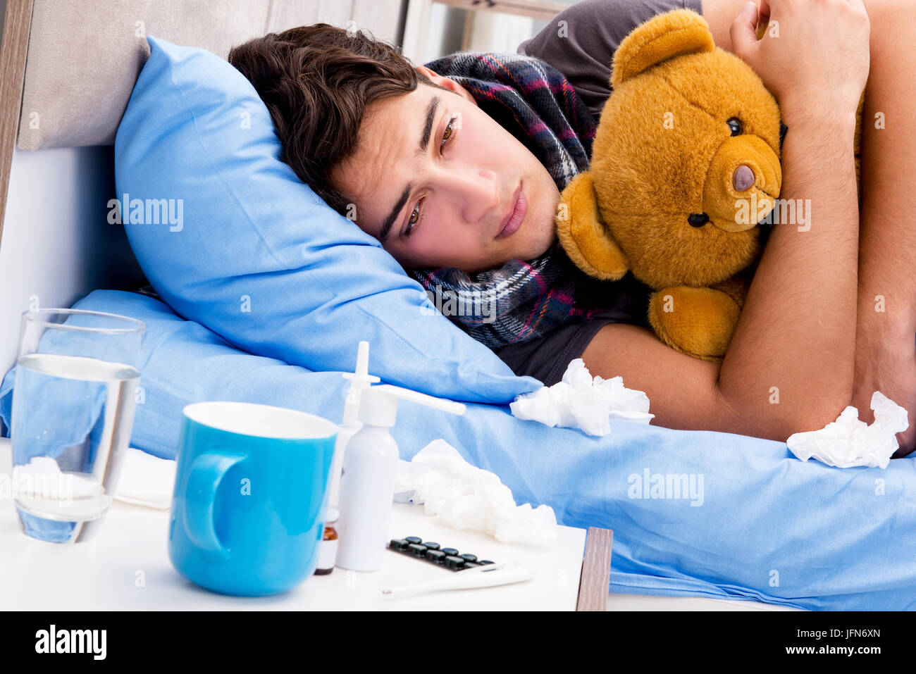 Sick ill man in the bed taking medicines and drugs Stock Photo - Alamy