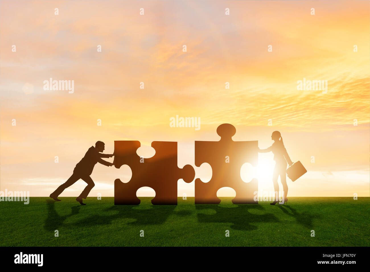 Business metaphor of teamwork with jigsaw puzzle Stock Photo - Alamy