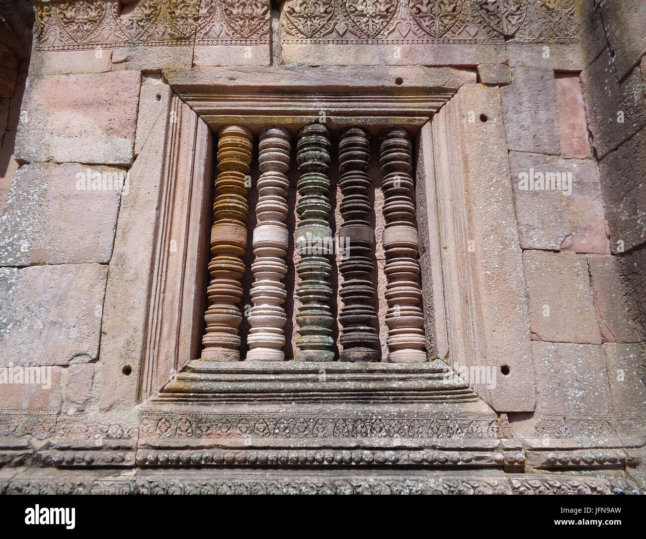 Window balusters made with different colors of stones at Prasat Hin ...