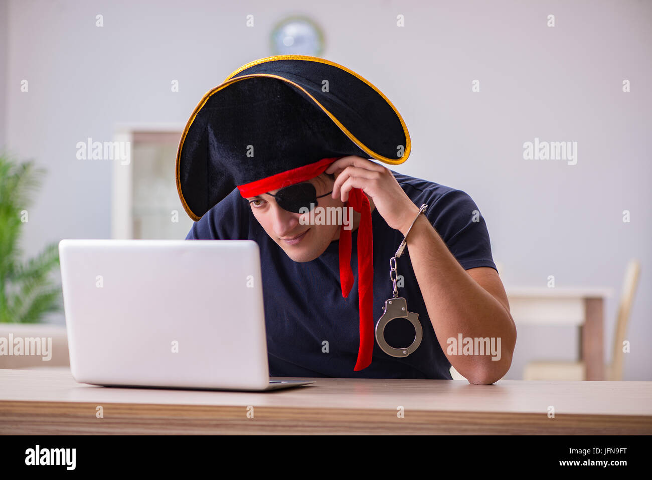 Digital security concept with pirate at computer Stock Photo - Alamy