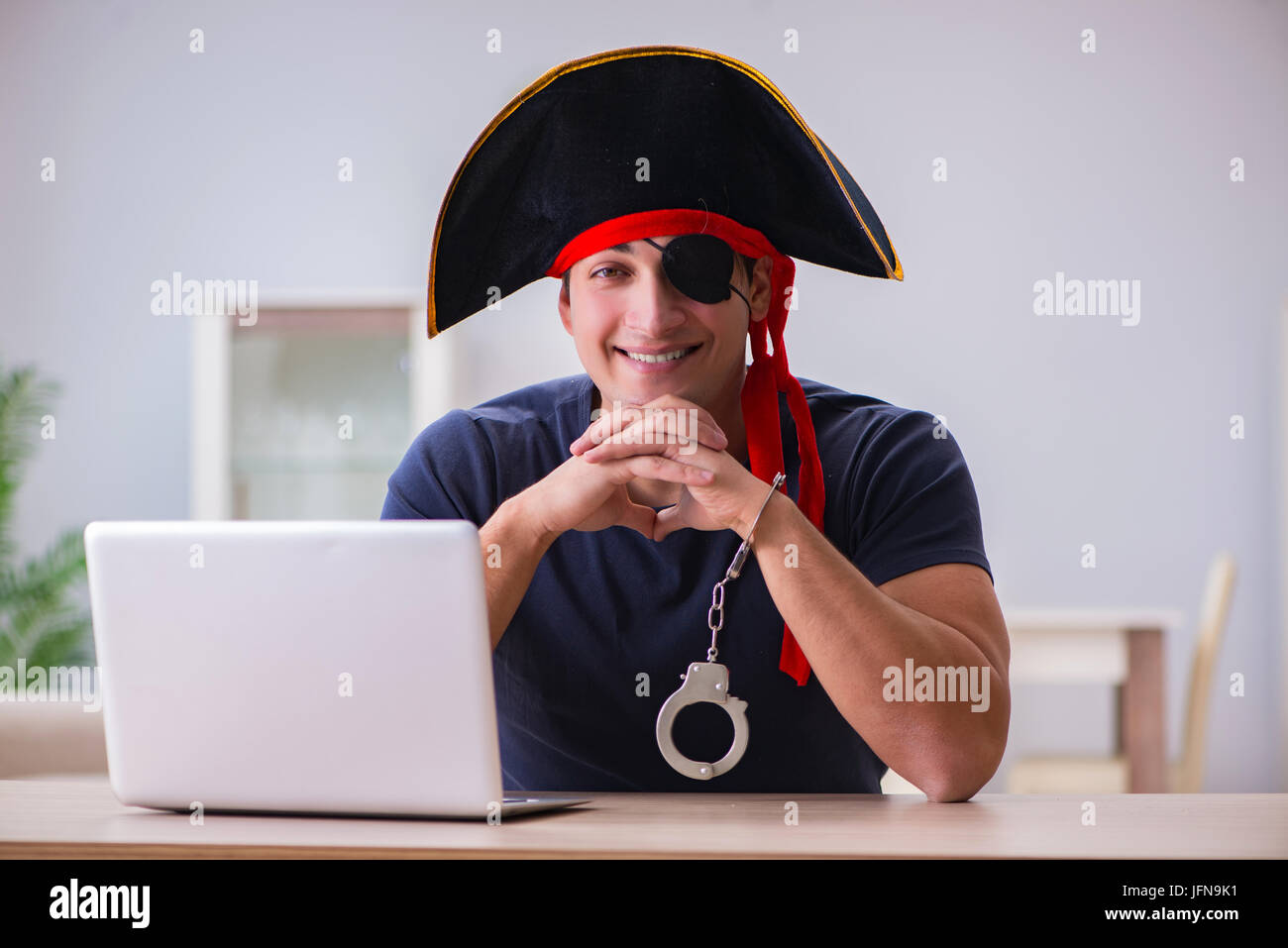 Digital security concept with pirate at computer Stock Photo - Alamy
